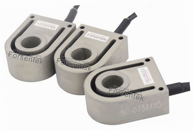 a través de la célula de carga del agujero