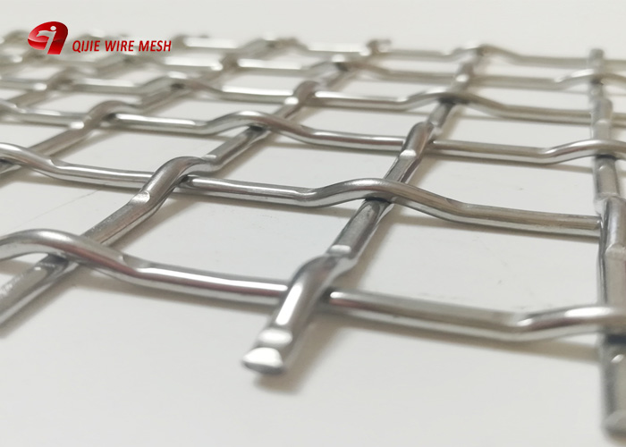 grillage serti par replis d'acier inoxydable