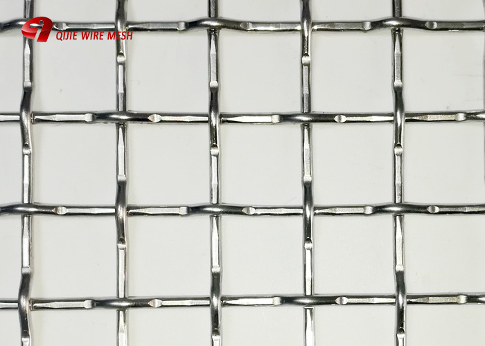 grillage serti par replis d'acier inoxydable